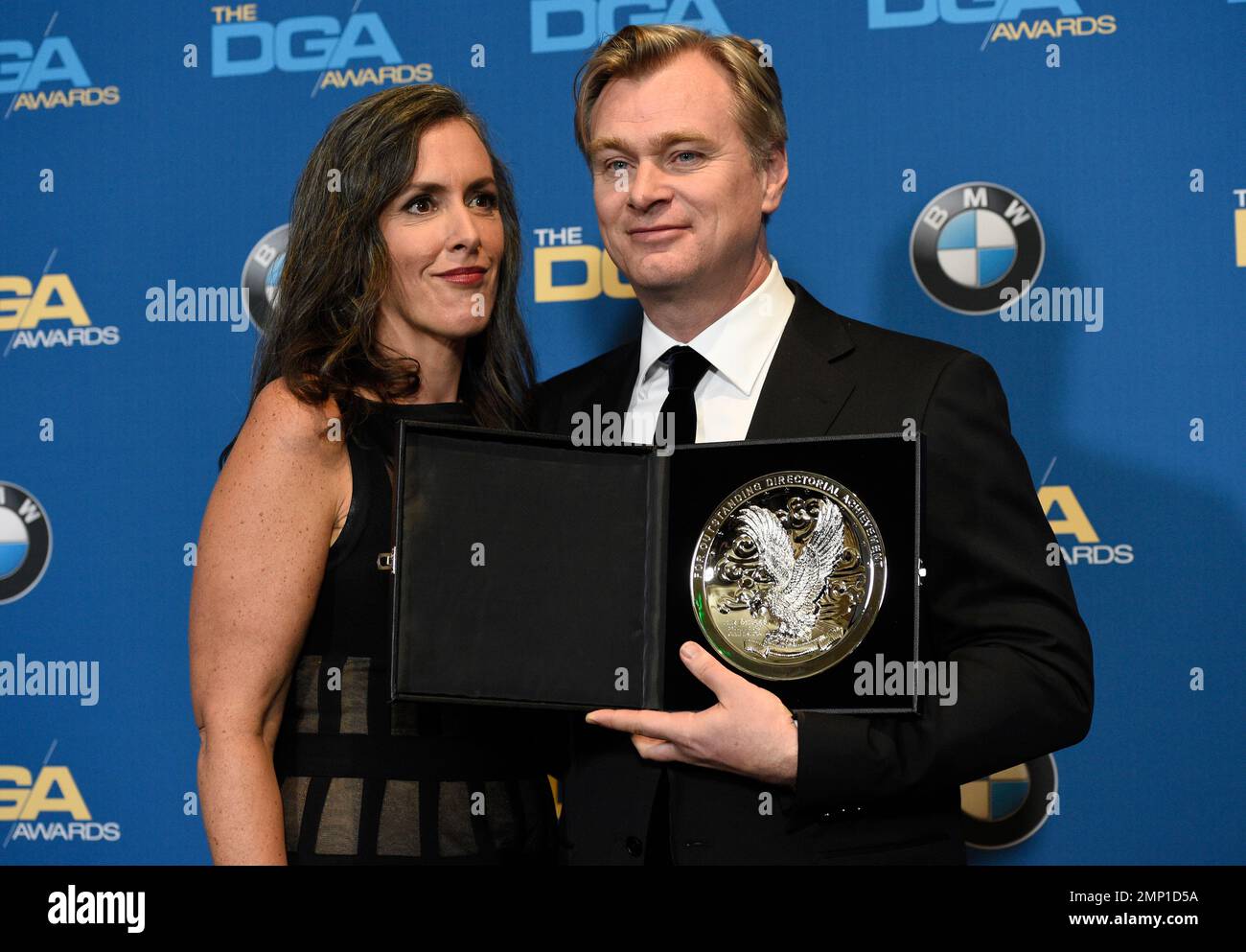 Emma Thomas, left, poses in the press room with Christopher Nolan and a ...