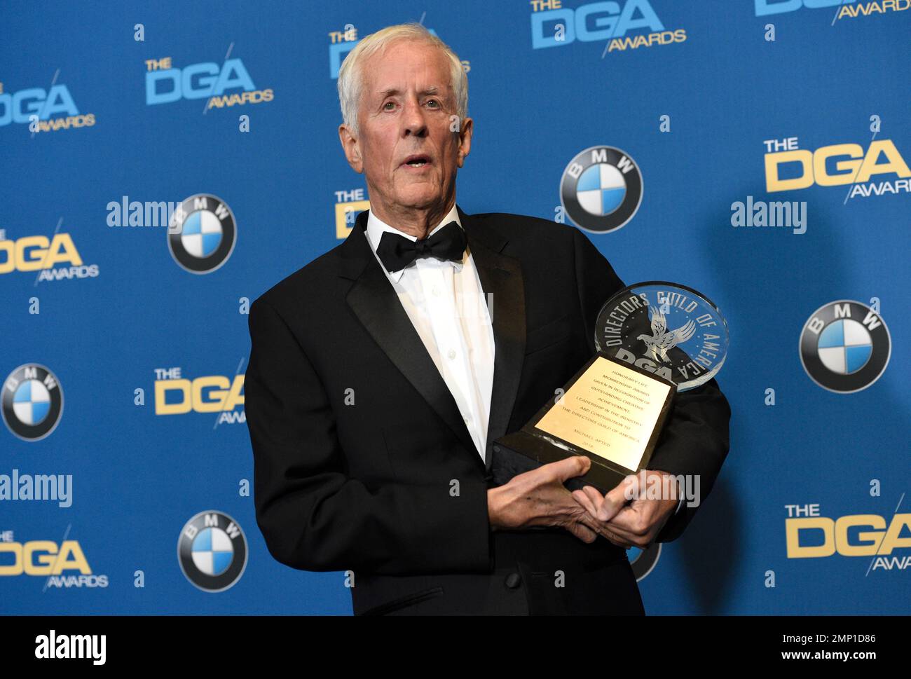 Michael Apted poses in the press room with the honorary life member ...