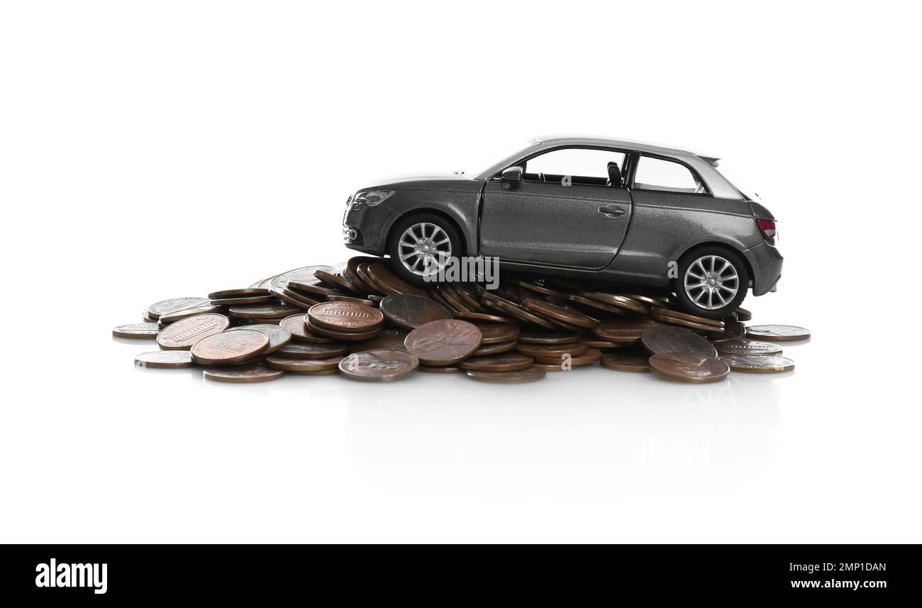 Miniature automobile model and money on white background. Car buying ...