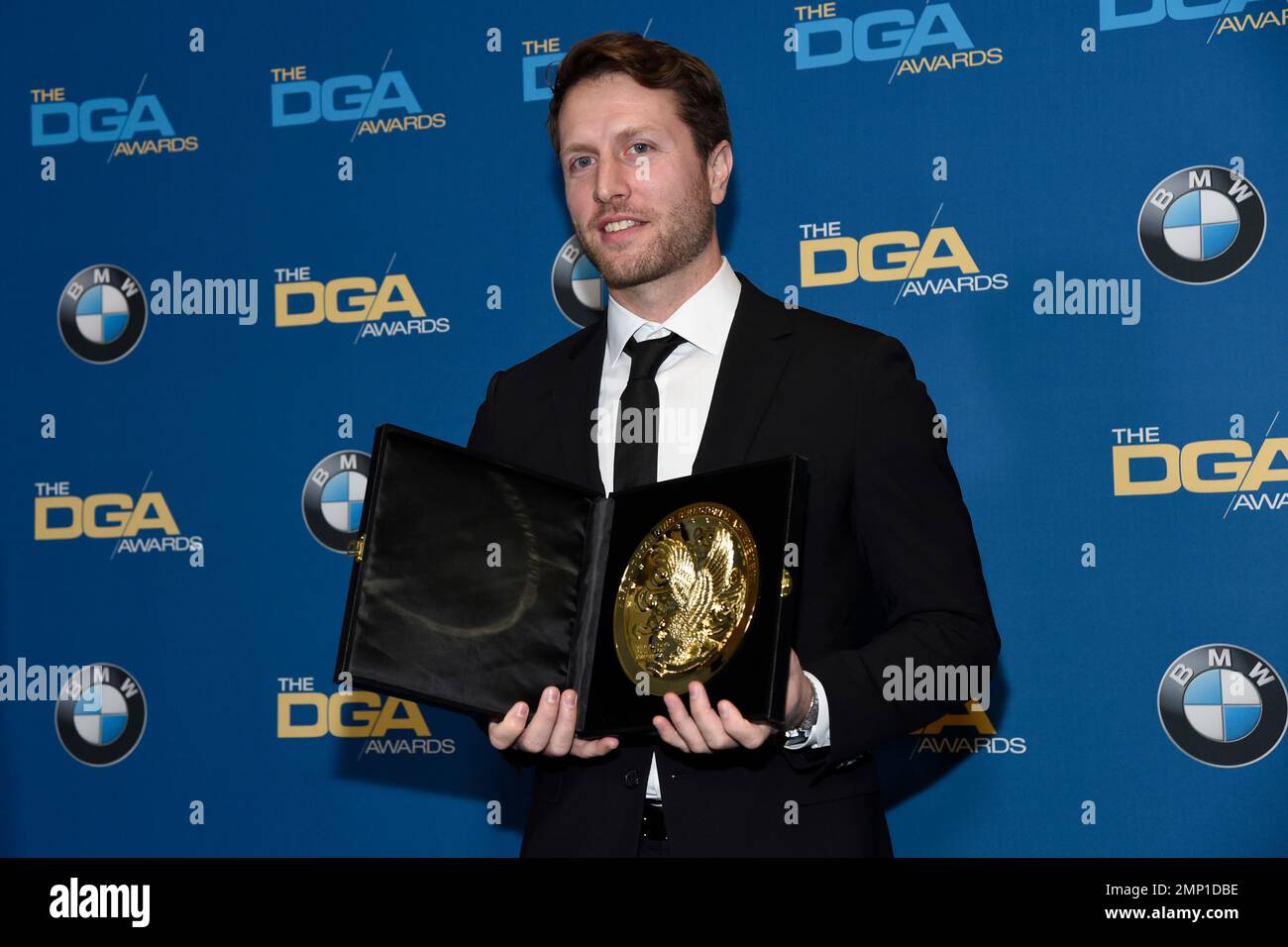 Matthew Heineman poses in the press room with his award for outstanding ...