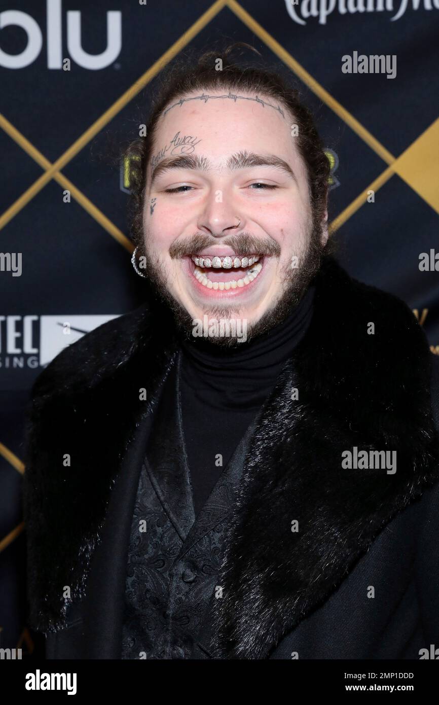 Post Malone arrives at the Maxim Super Bowl Party at the Maxim Dome on ...