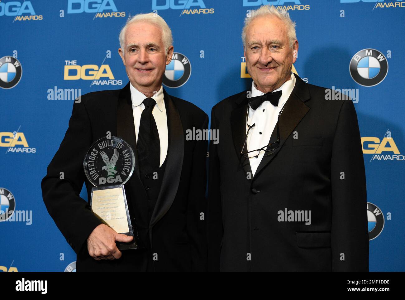 Don Mischer, right, poses in the press room with Jim Tanker, winner of ...
