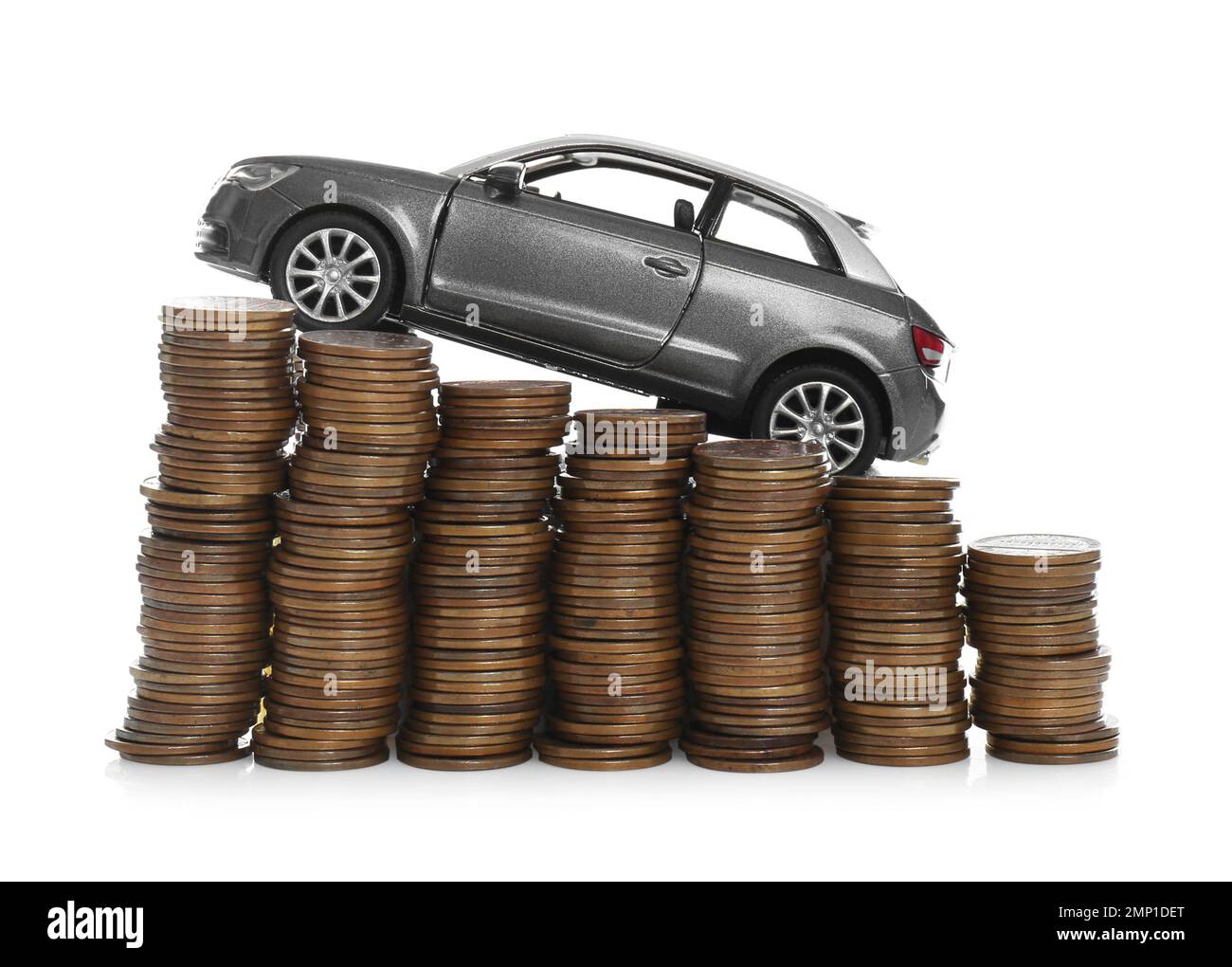 Miniature automobile model and money on white background. Car buying ...