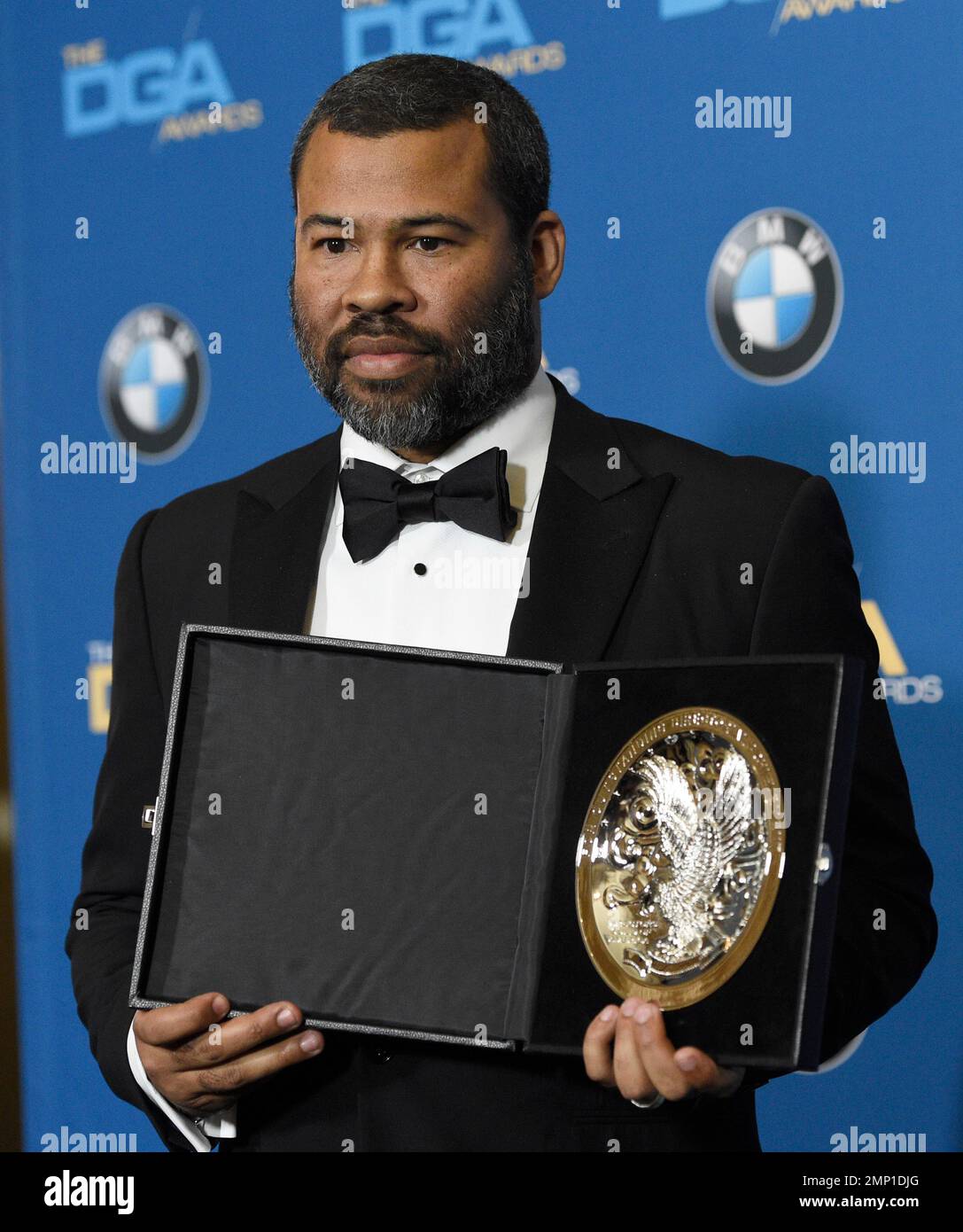 Jordan Peele poses in the press room with a medallion honoring his ...