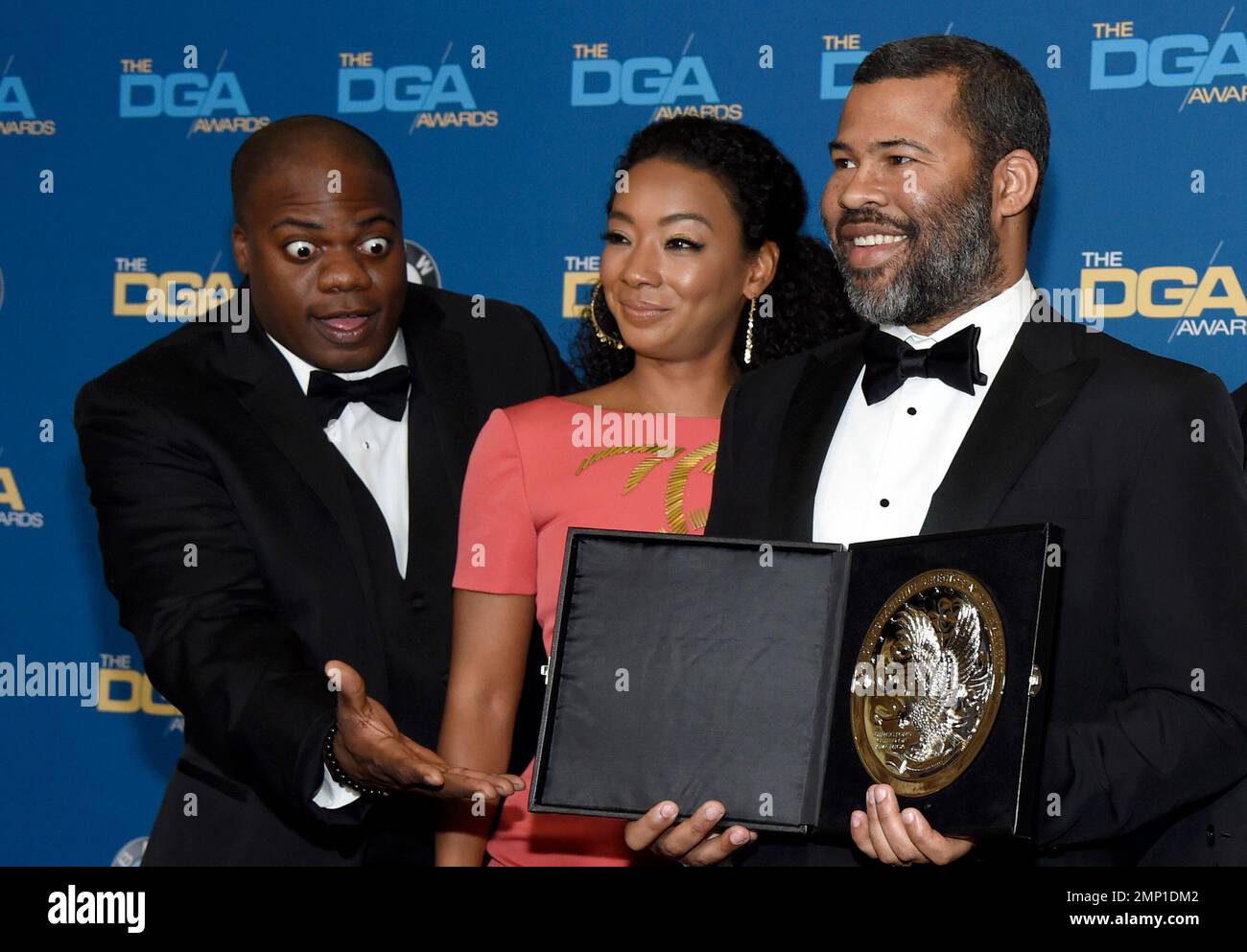 Marcus Henderson, from left, and Betty Gabriel pose with Jordan Peele ...
