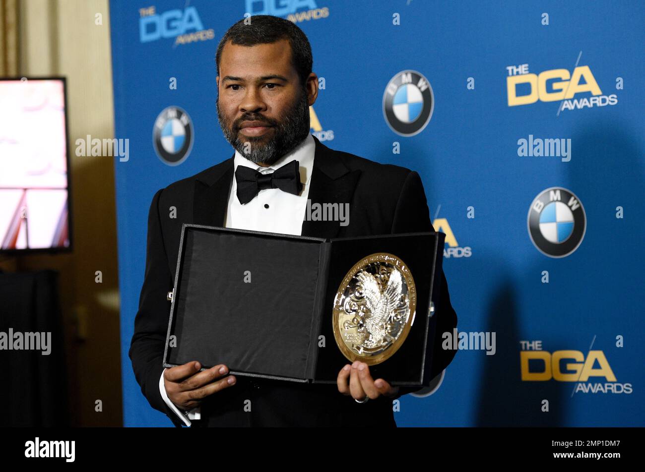 Jordan Peele poses in the press room with a medallion honoring his ...