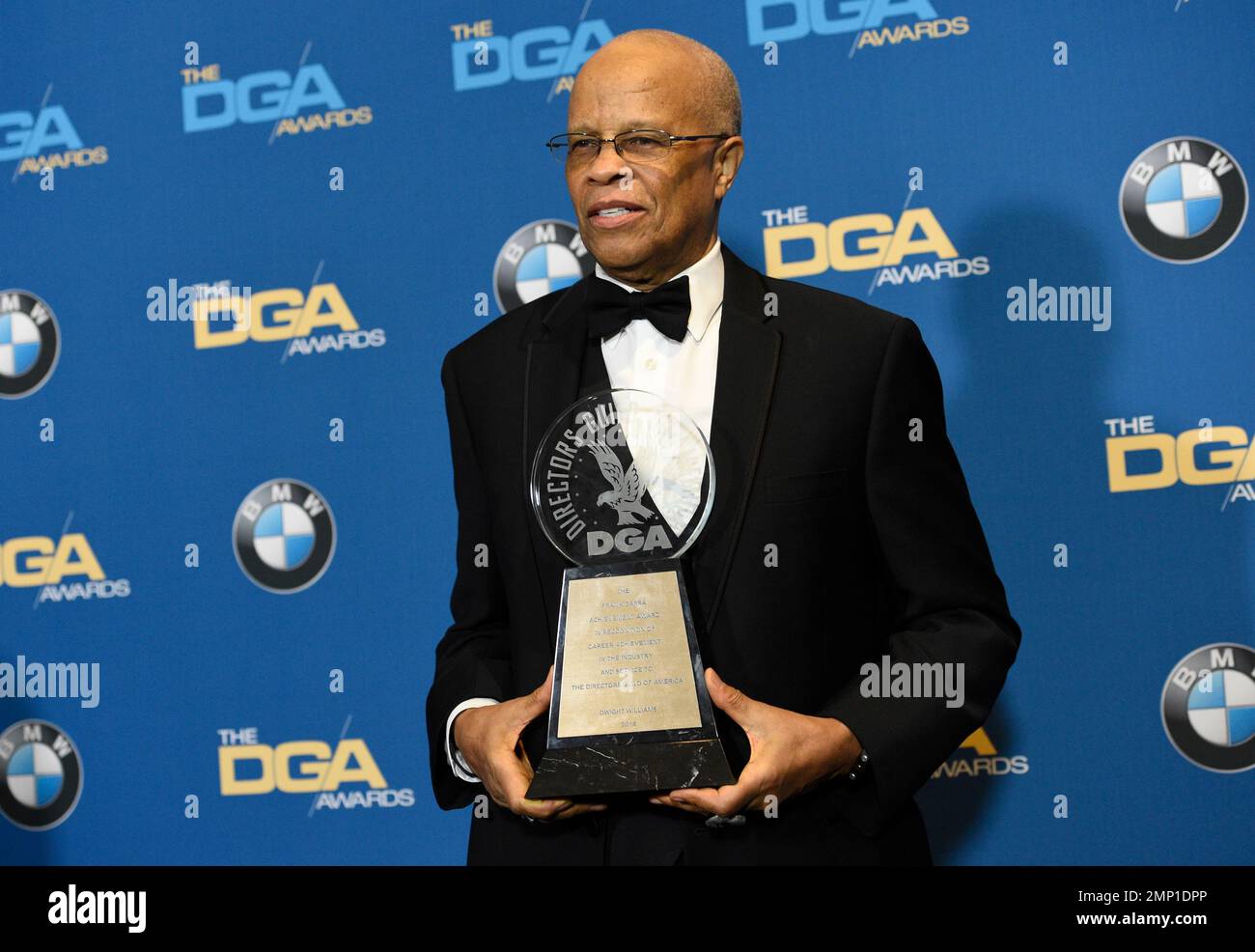 Dwight Williams poses in the press room with the Frank Capra ...