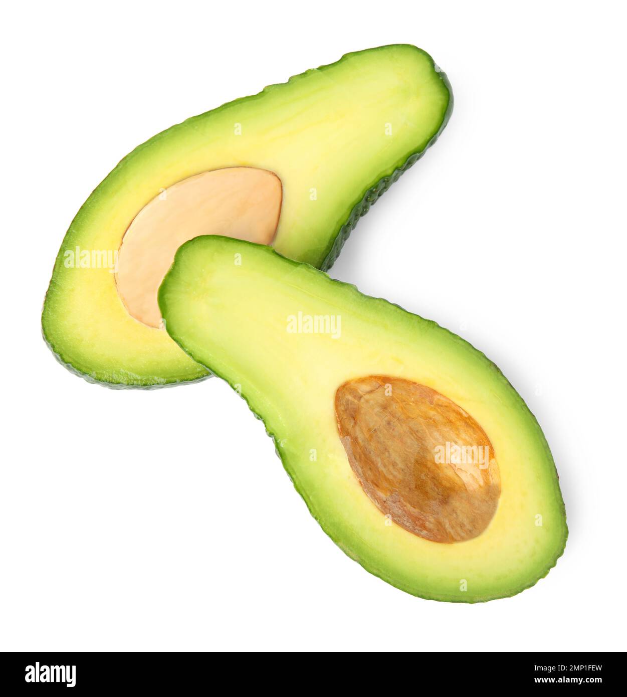 Cut tasty ripe avocados on white background, top view. Tropical fruit ...