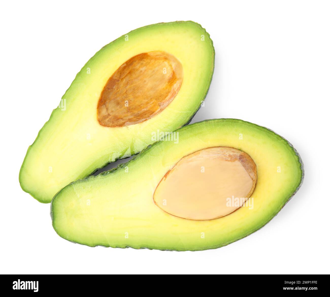 Cut tasty ripe avocados on white background, top view. Tropical fruit ...