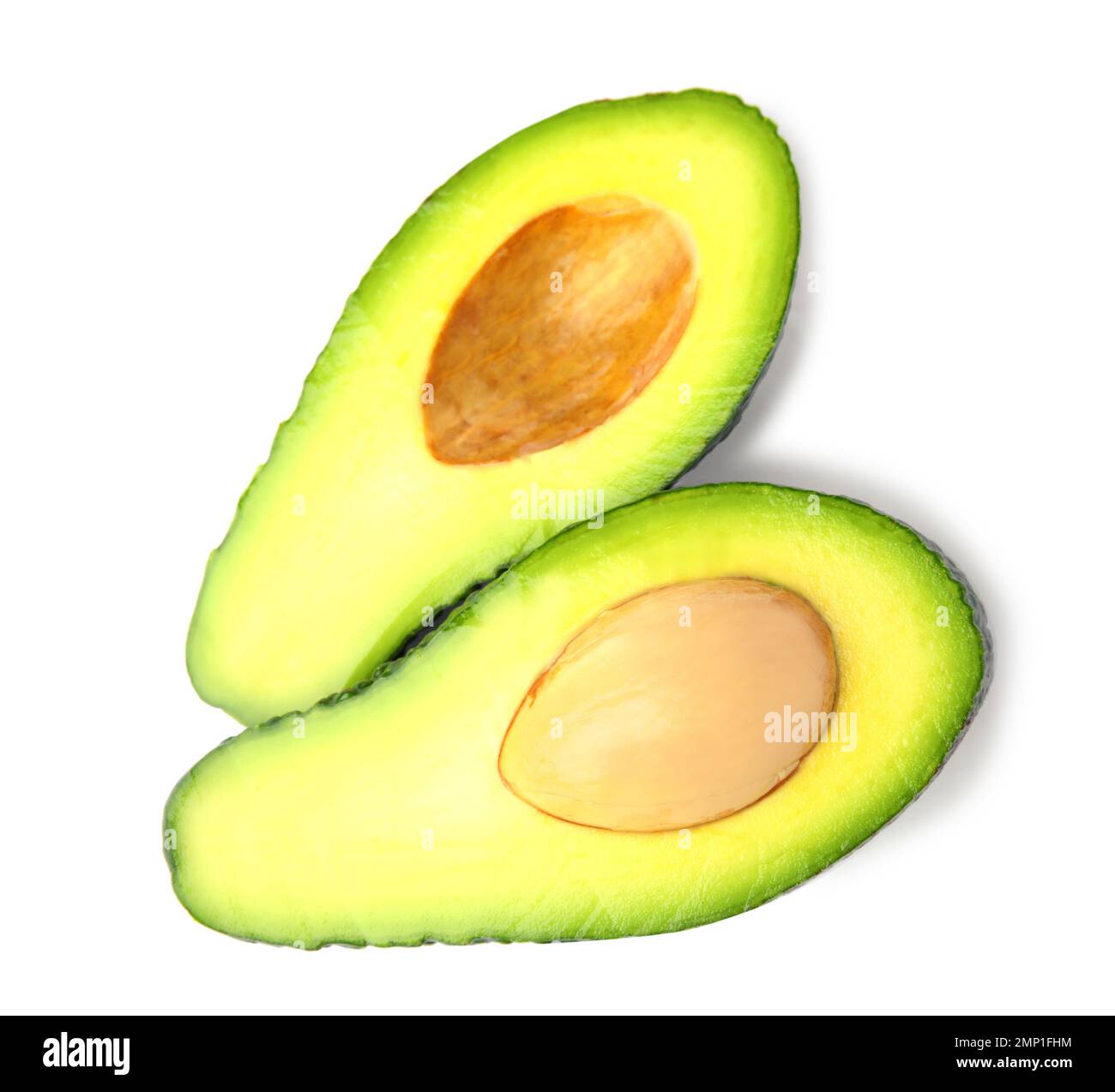 Cut tasty ripe avocados on white background, top view. Tropical fruit ...