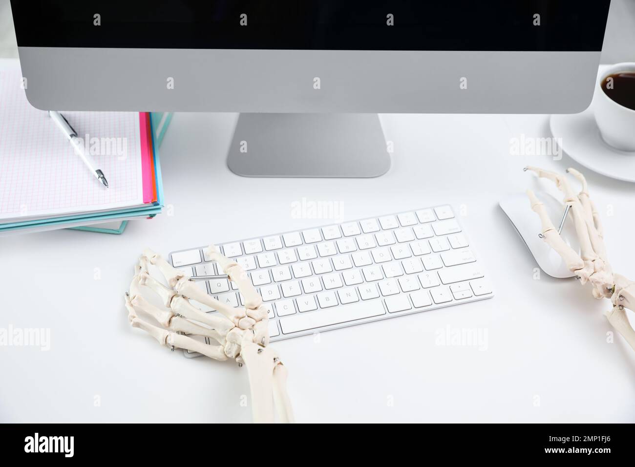 Human skeleton at table in office, closeup Stock Photo - Alamy