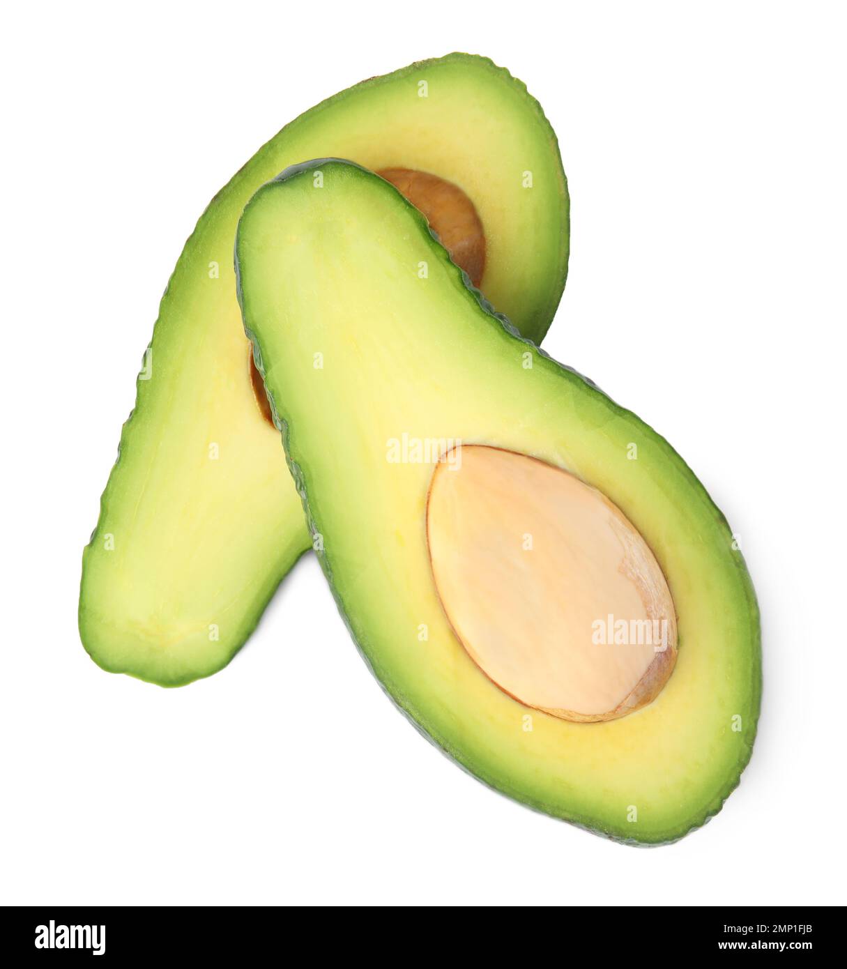 Cut tasty ripe avocados on white background, top view. Tropical fruit ...