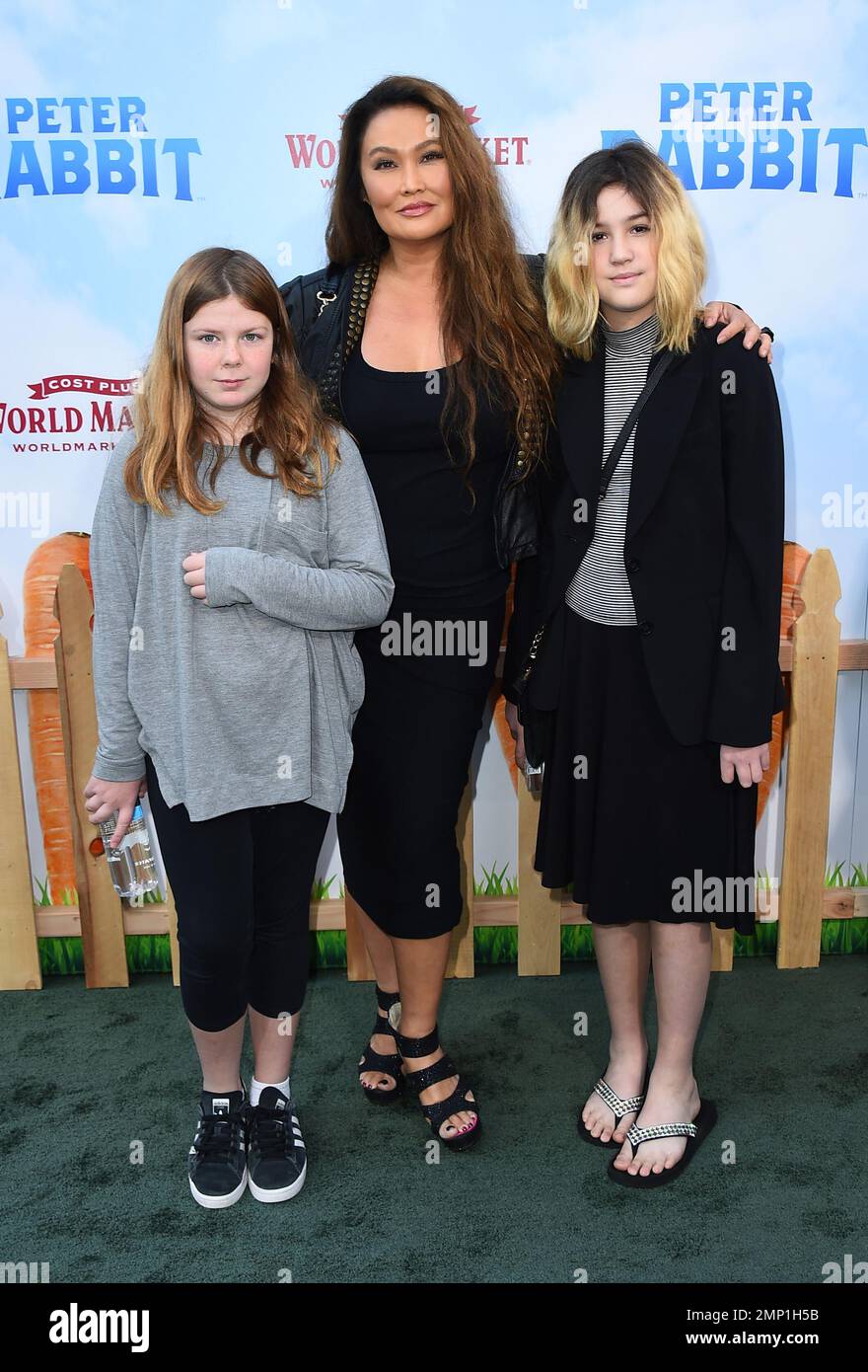 Tia Carrere arrives with his family at the world premiere of "Peter ...
