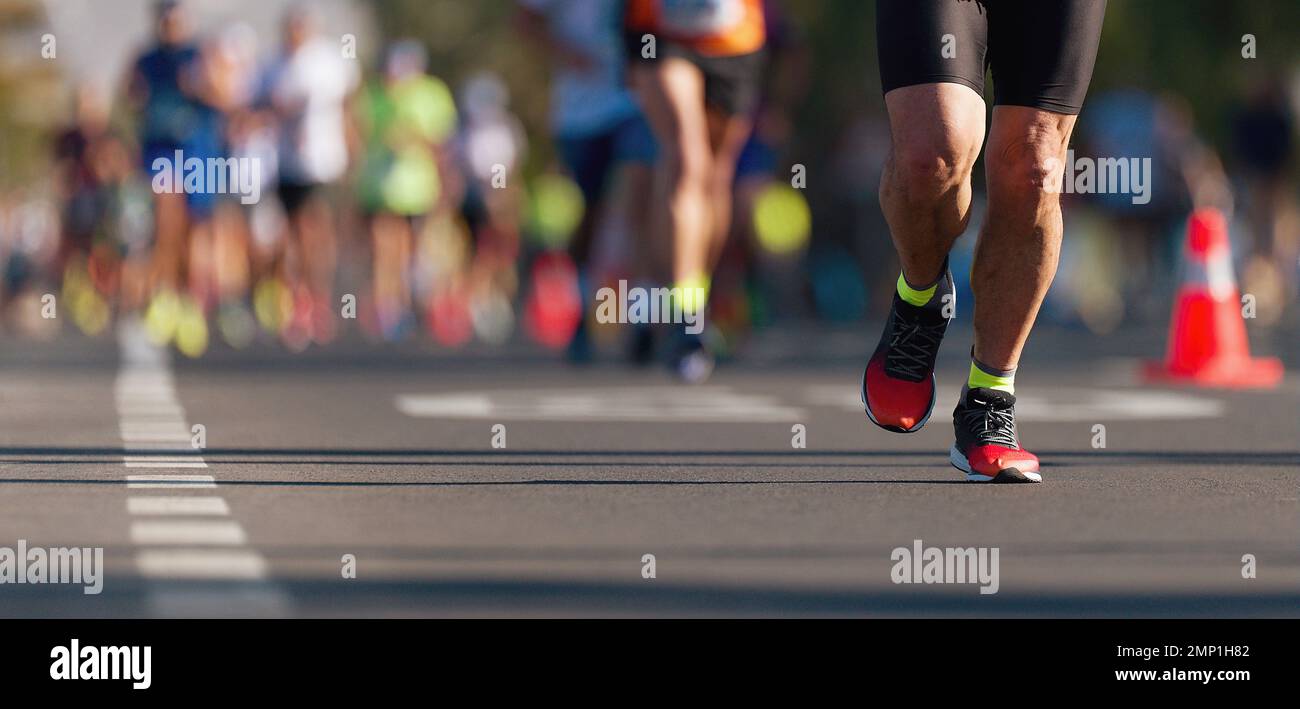 Marathon running race, people feet on city road Stock Photo - Alamy