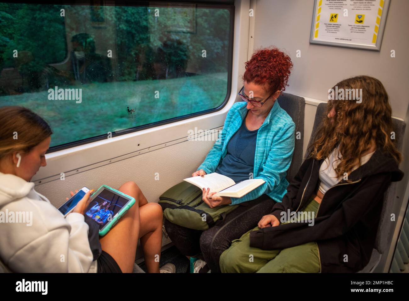 People inside of the the Cremellera rack and pinion train line in the ...