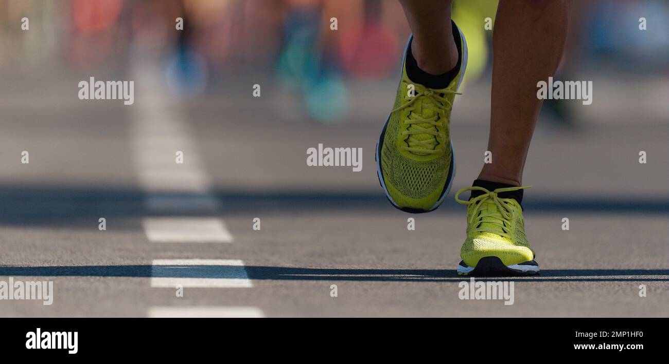Marathon running race, people feet on city road Stock Photo - Alamy