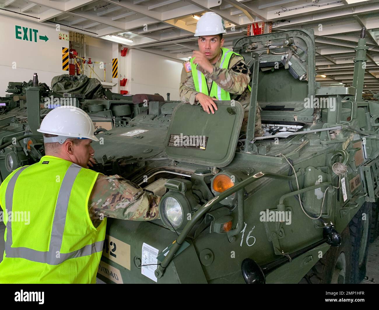 Soldiers assigned to the 2nd Infantry Division offload Stryker vehicles ...