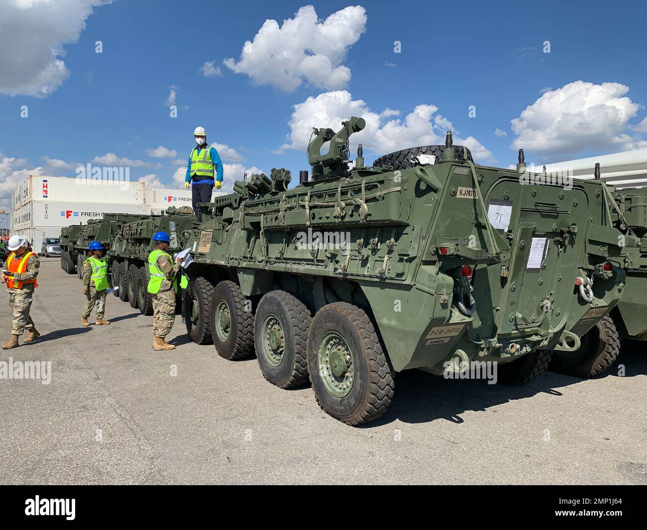 Soldiers and civilians check inventory of Stryker vehicles belonging to ...
