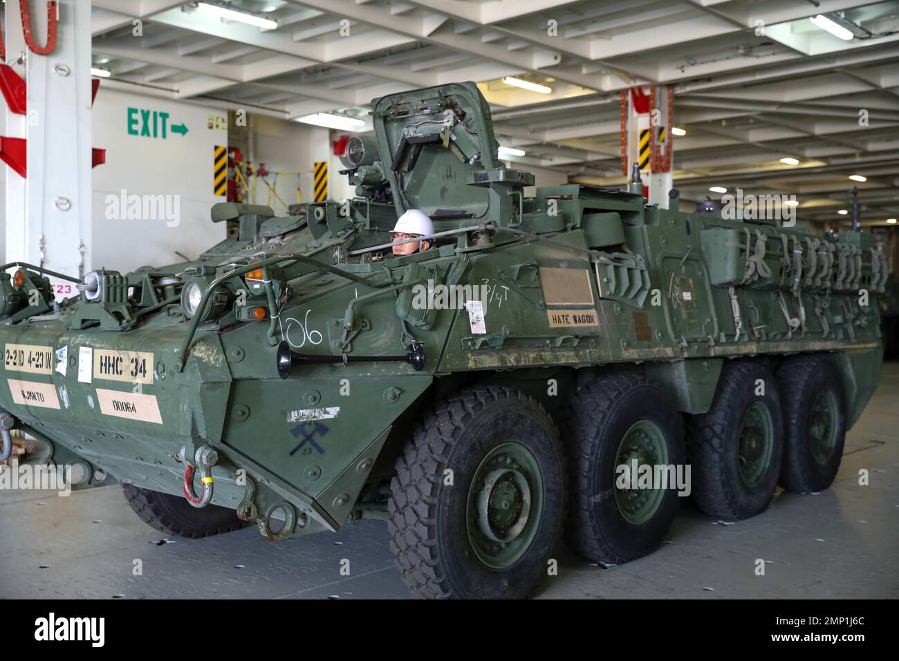 A civilian driver guides a Stryker combat vehicle off the Liberty ...