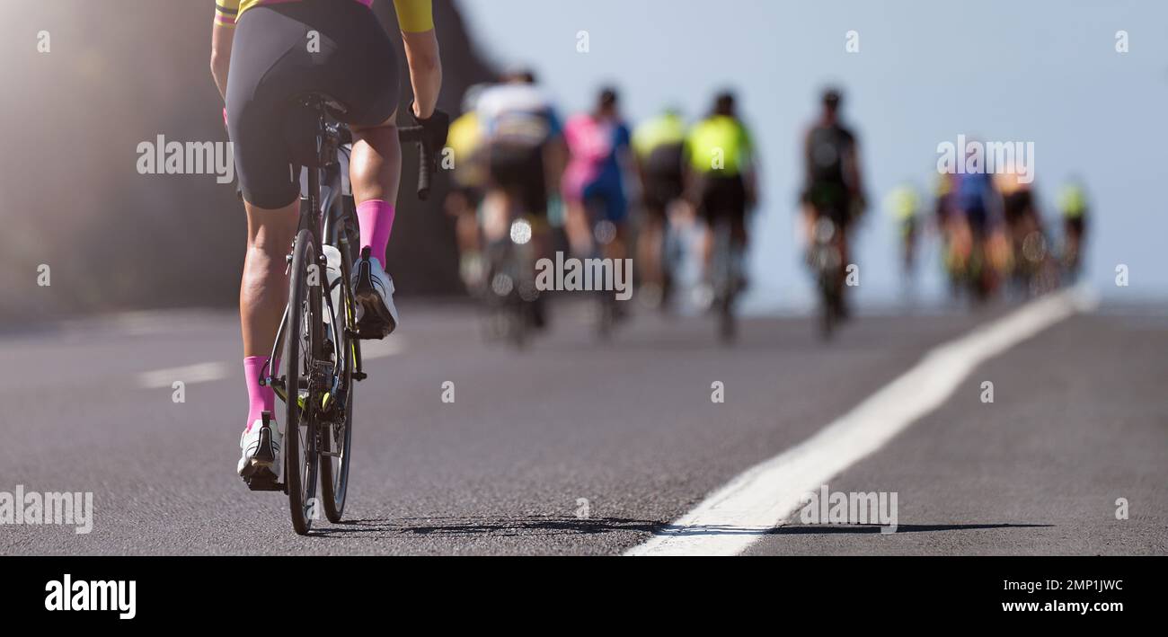 Group of cyclist at professional race, cyclists in a road race stage ...
