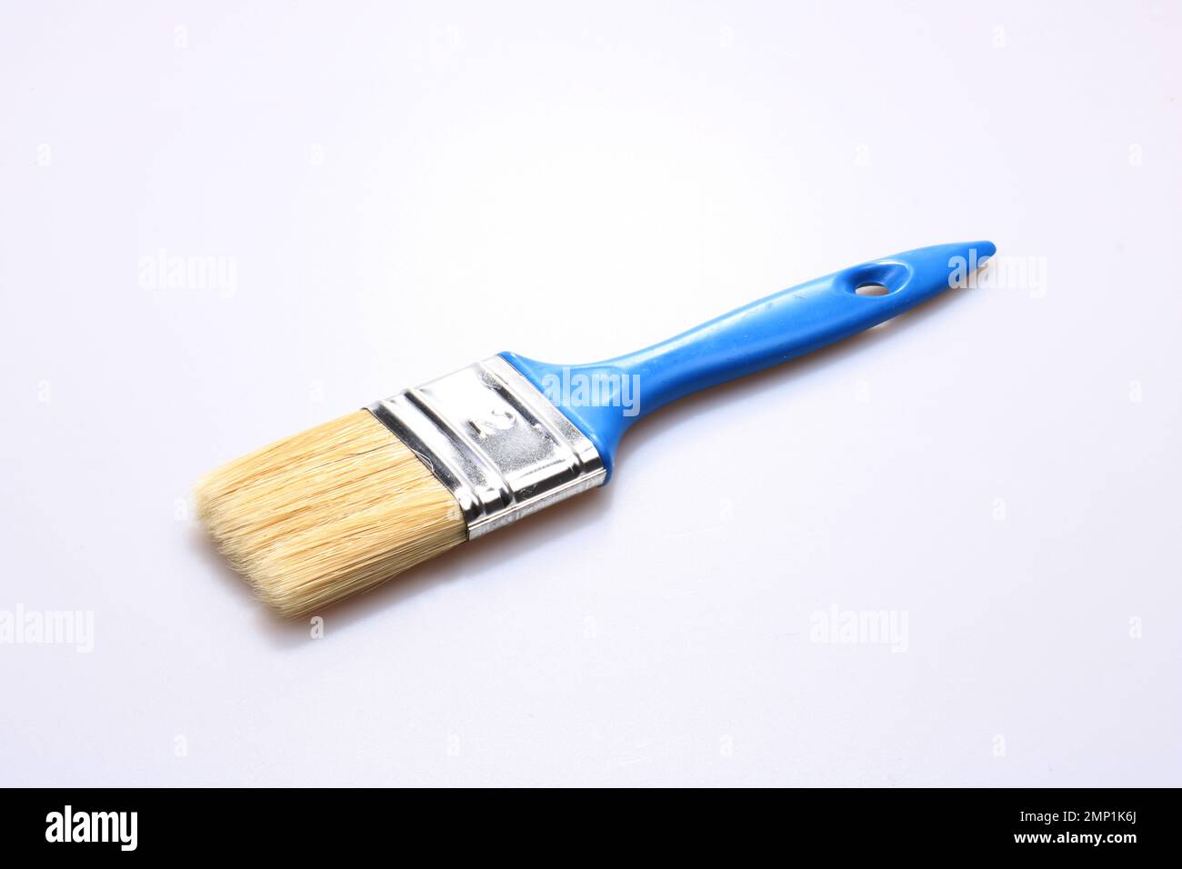 Blue Paintbrush isolated on a white background Stock Photo - Alamy