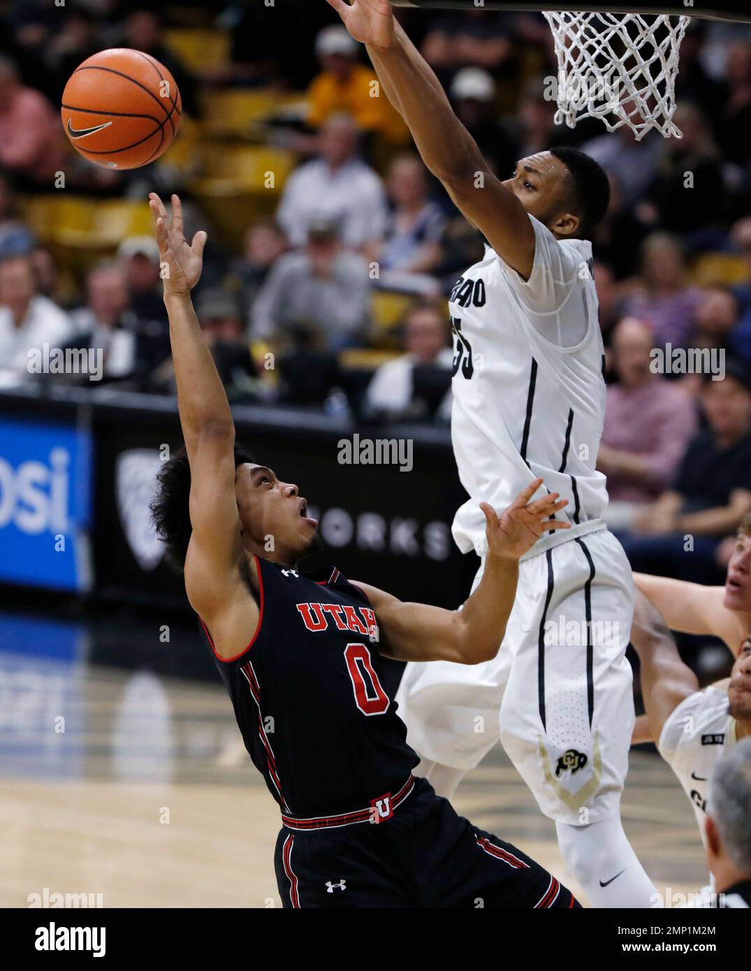 Colorado forward Dallas Walton, right, goes up to block a shot by Utah ...