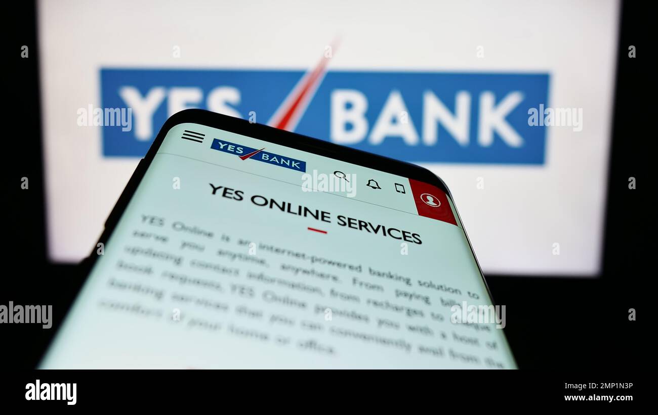 Mobile phone with website of Indian financial services company Yes Bank ...