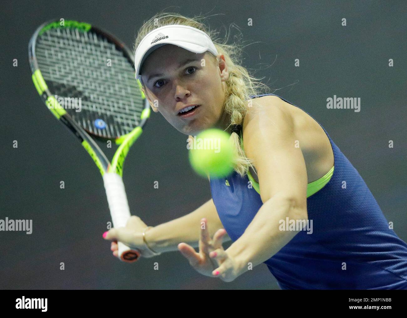 Caroline Wozniacki of Denmark returns the ball to Daria Kasatkina of ...