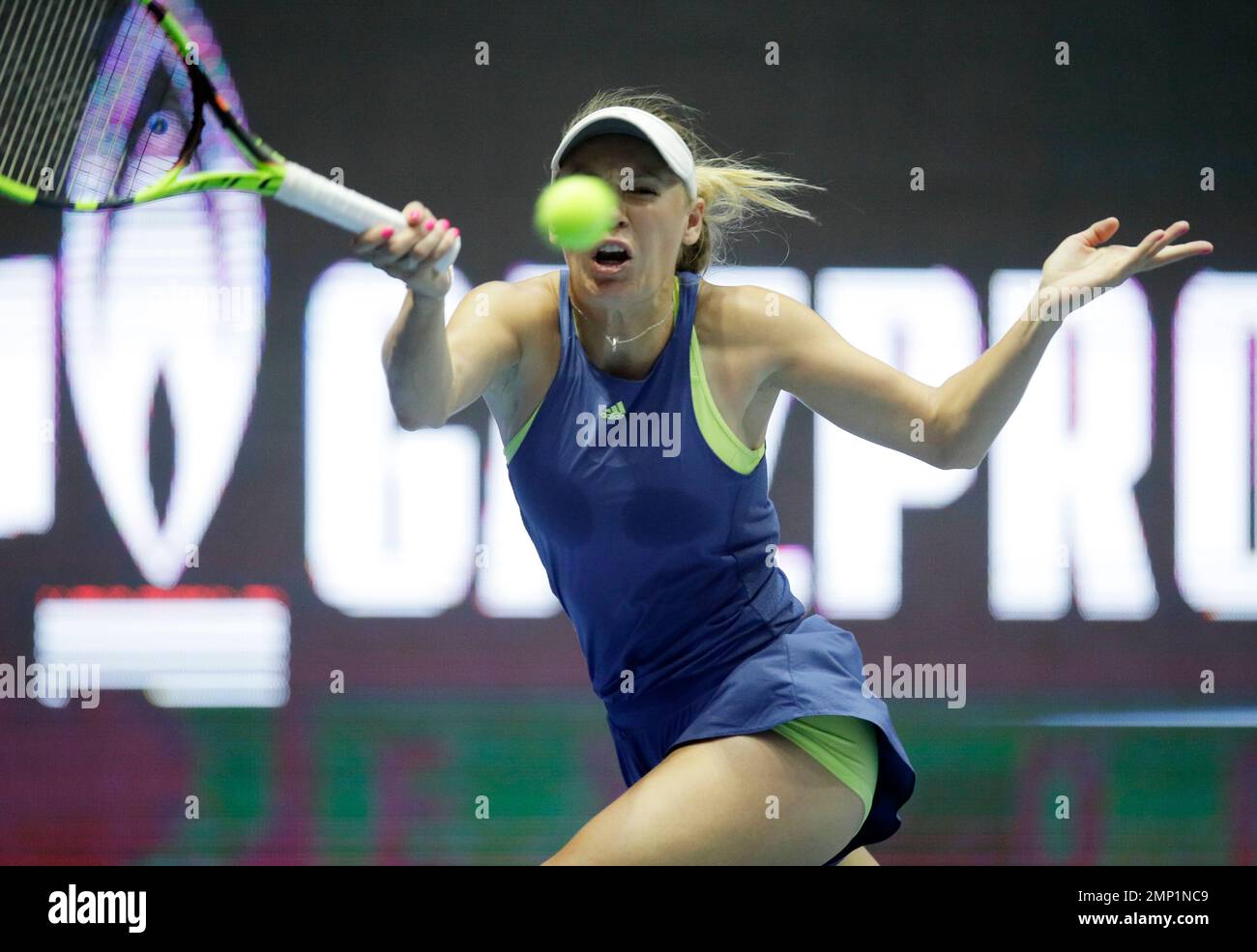 Caroline Wozniacki of Denmark returns the ball to Daria Kasatkina of ...