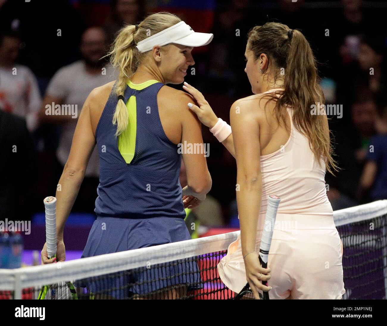 Caroline Wozniacki of Denmark, left, and Daria Kasatkina of Russia ...