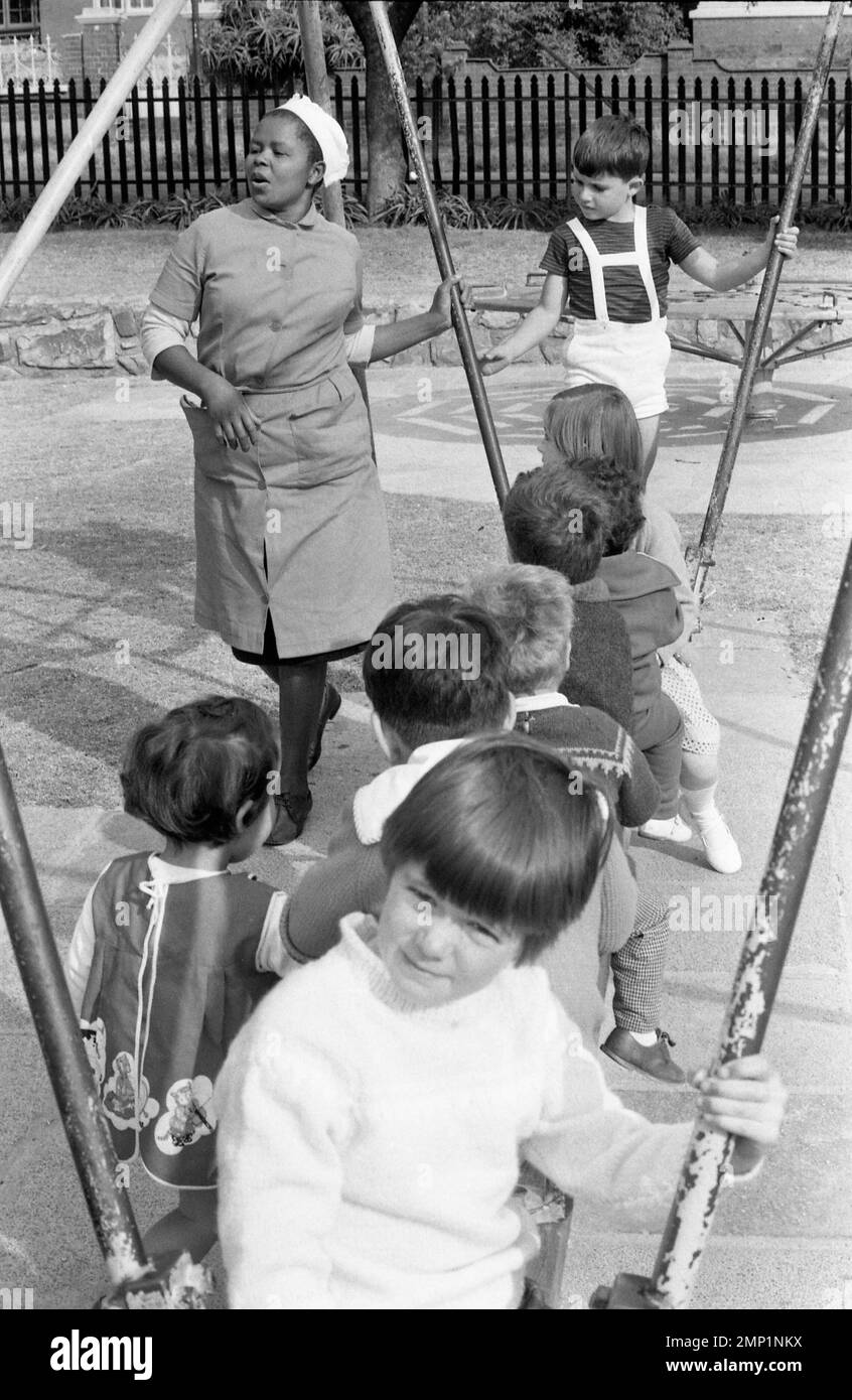 Children play in an all white park in Johannesburg, South Africa as a ...