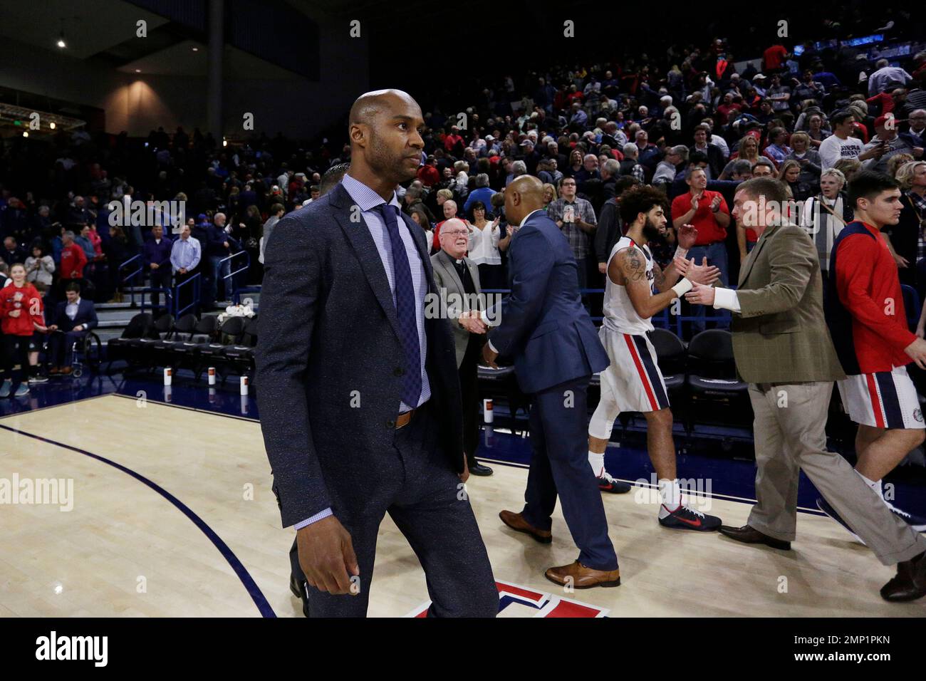 San Diego head coach Lamont Smith walks off the court after an NCAA ...