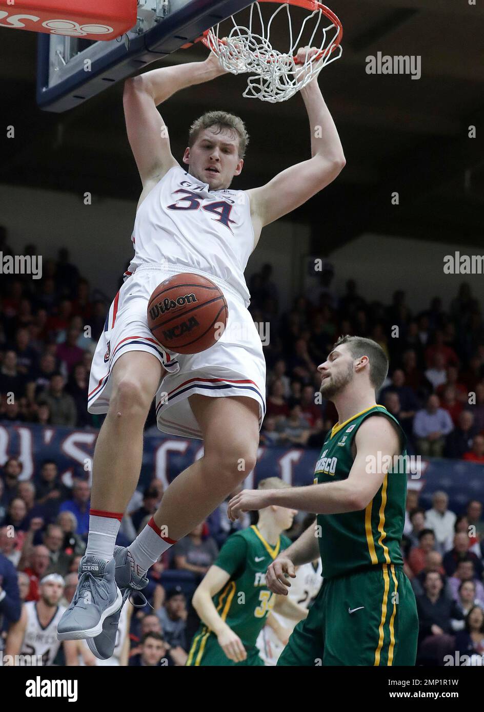 Saint Mary's (Cal.) center Jock Landale (34) dunks over San Francisco ...