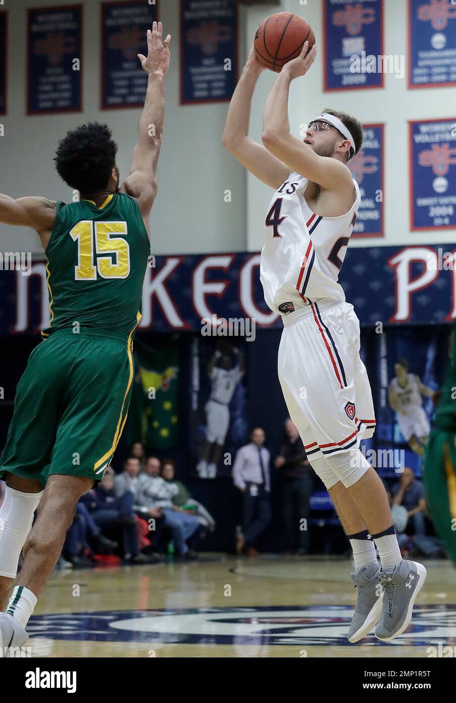 Saint Mary's (Cal.) forward Calvin Hermanson, right, shoots over San ...