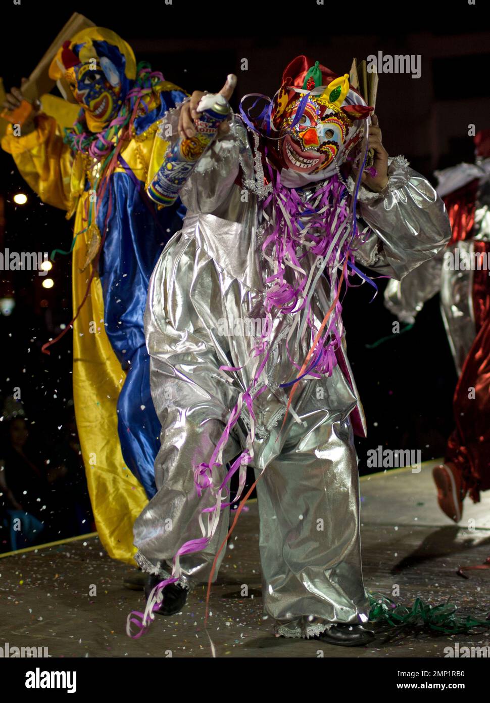 A contestant dressed as the Carnival character Pepino shows off his ...