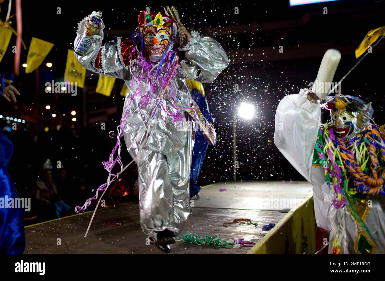 A contestant dressed as the Carnival character Pepino shows off his ...