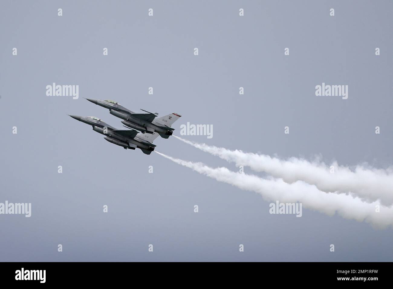 Two Republic of Singapore Air Force F-16 fighter jets perform a ...