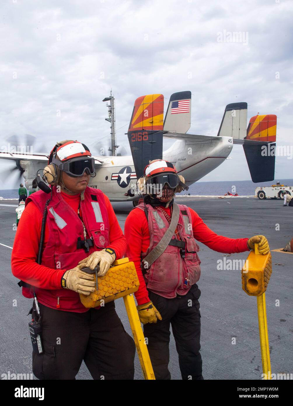 Aviation Boatswain's Mate (Handling) 2nd Class Mark Rubio, left, from ...