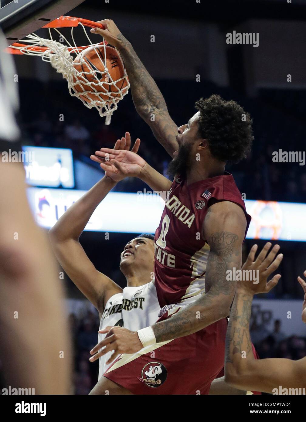 Florida State's Phil Cofer (0) dunks against Wake Forest's Doral Moore ...