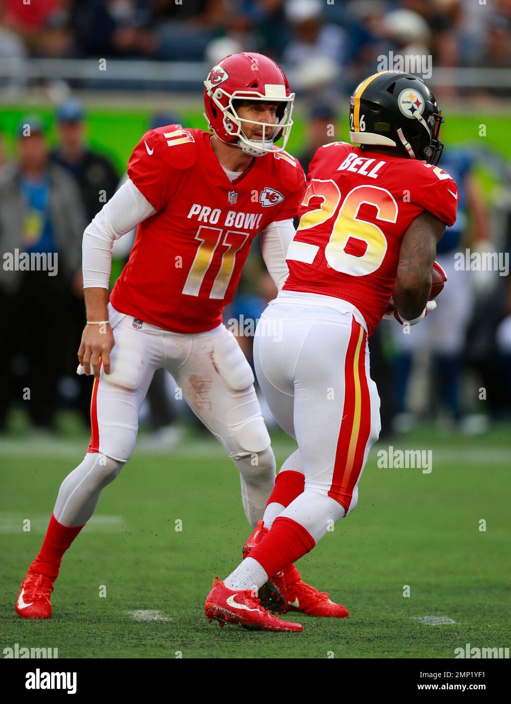 Kansas City Chiefs quarterback Alex Smith (11) hands the ball off ...