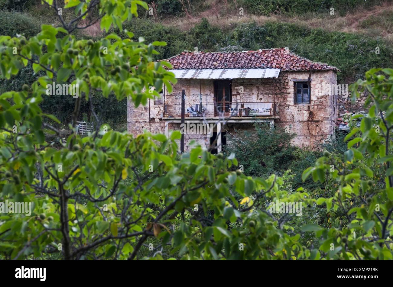 old stone house in Zarouhla village. Achaia, Greece Stock Photo - Alamy