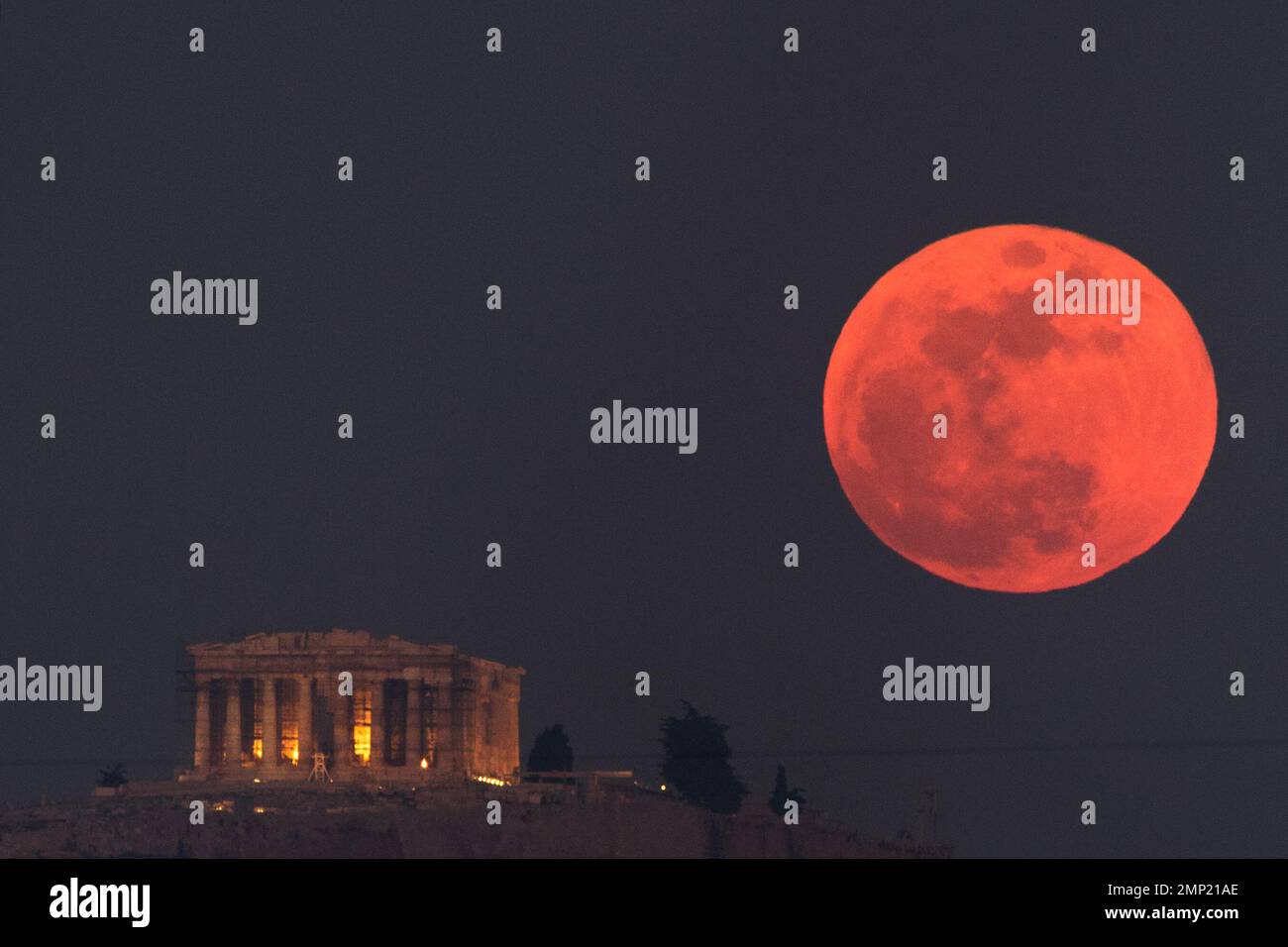 A super blue blood moon rises behind the 2,500-year-old Parthenon ...