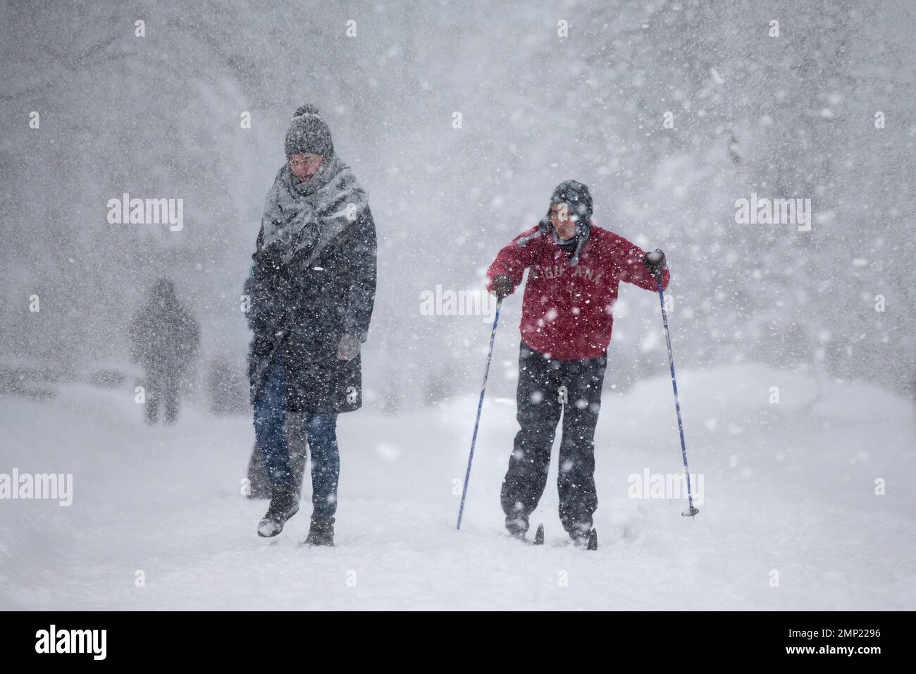 People walk and ski during snowfall in a park in Moscow, Russia ...