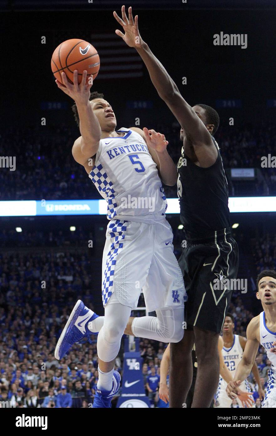 Kentucky's Kevin Knox (5) shoots while defended by Vanderbilt's Clevon ...