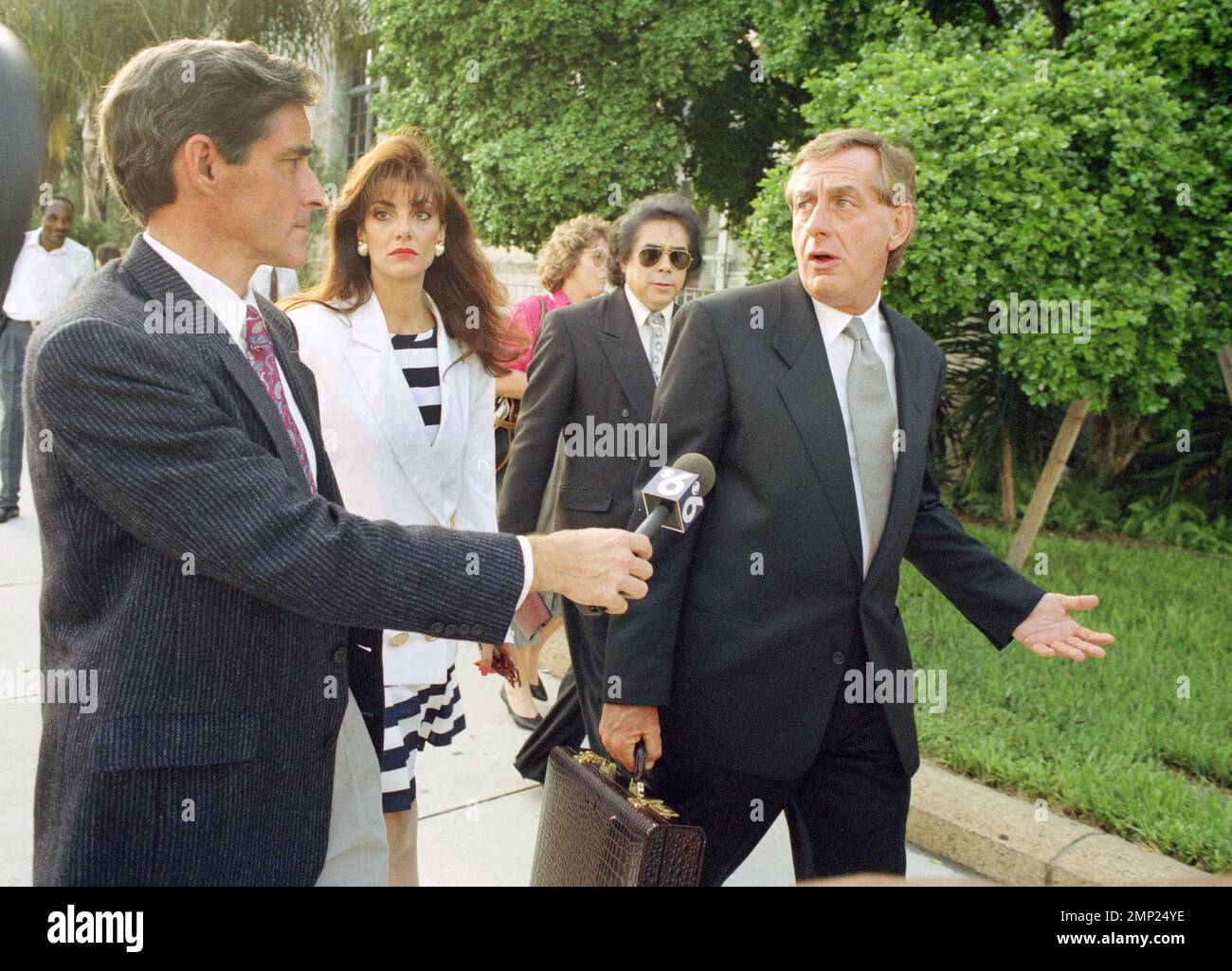 The defense attorney for Manuel Noriega, Frank Rubino, right, throws ...