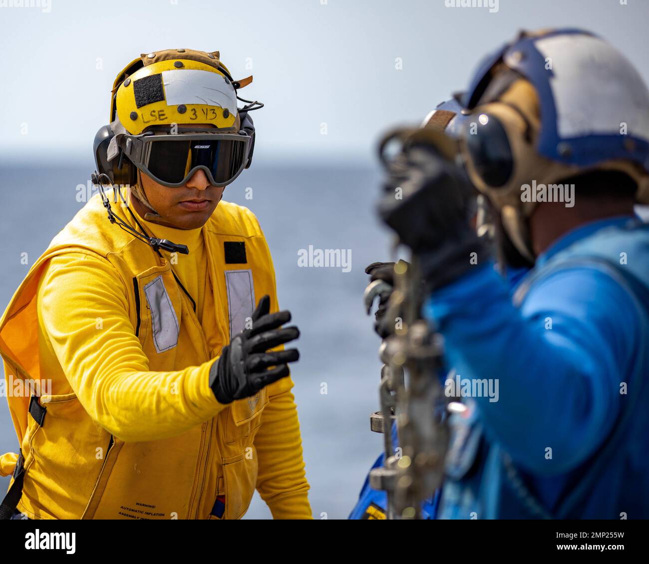 Boatswain’s Mate 3rd Class Elvin Rivera Perez, left, assigned to the ...