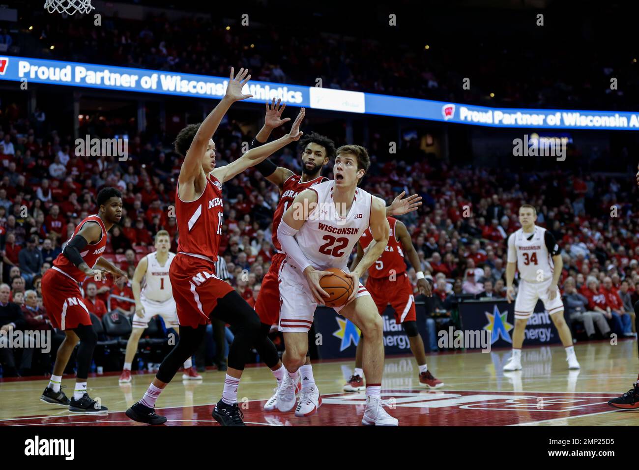 Wisconsin's Ethan Happ (22) against Nebraska's Isaiah Roby (15) and ...