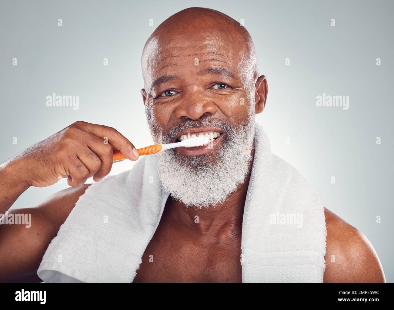 Black man, dental hygiene and toothbrush with wellness, brushing teeth and smile on grey studio ...