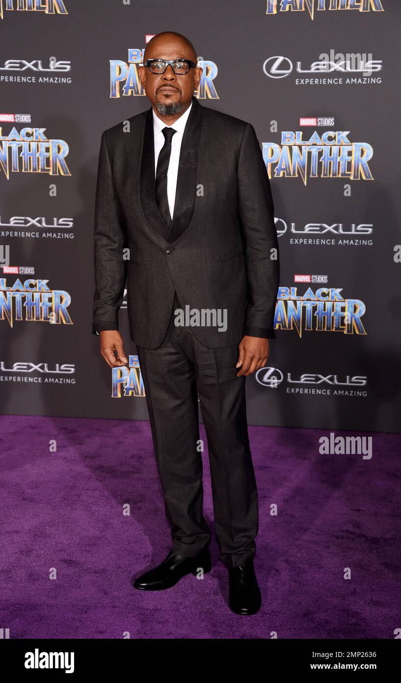 Forest Whitaker, a cast member in "Black Panther," poses with her ...