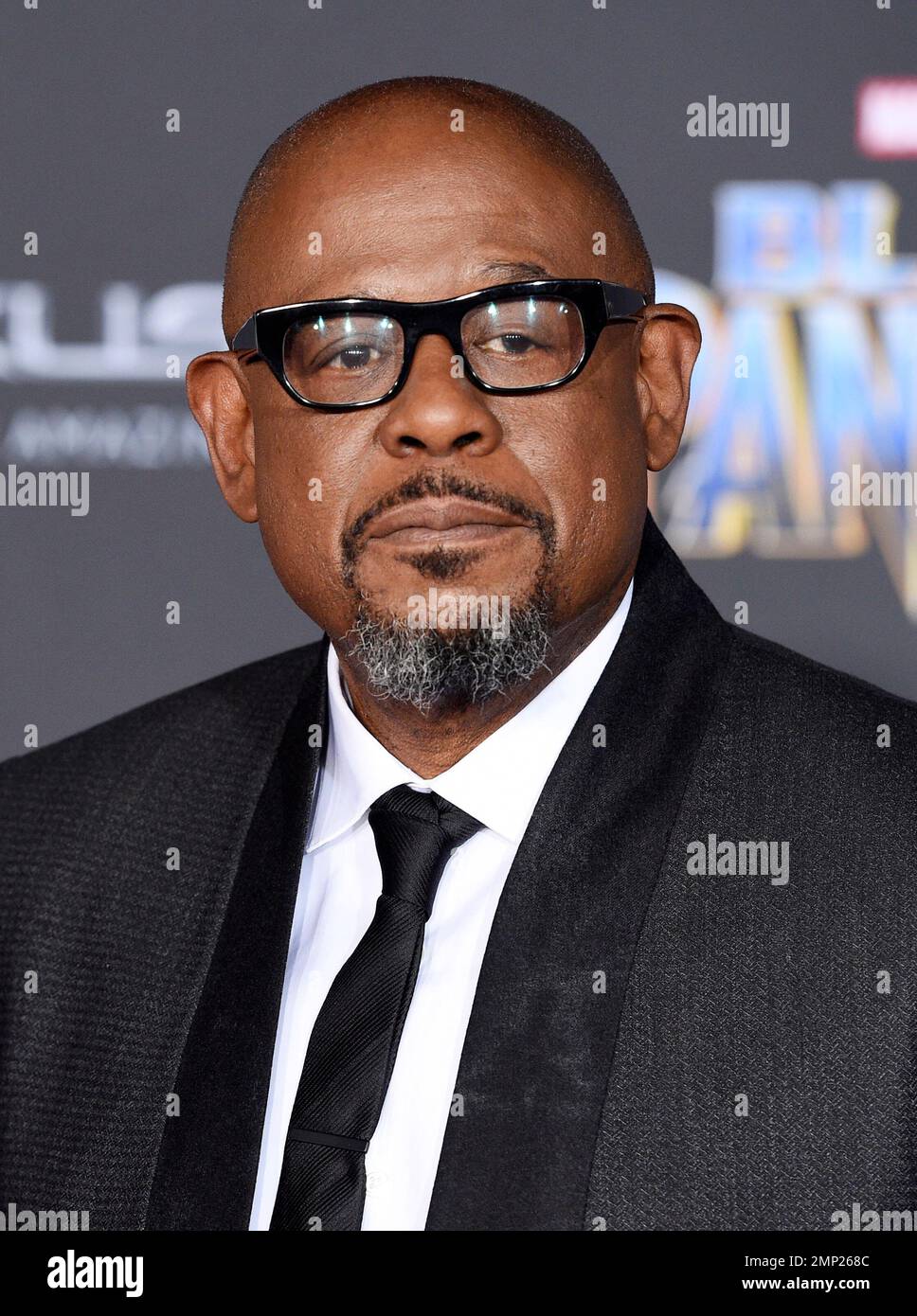 Forest Whitaker, a cast member in "Black Panther," poses with her ...